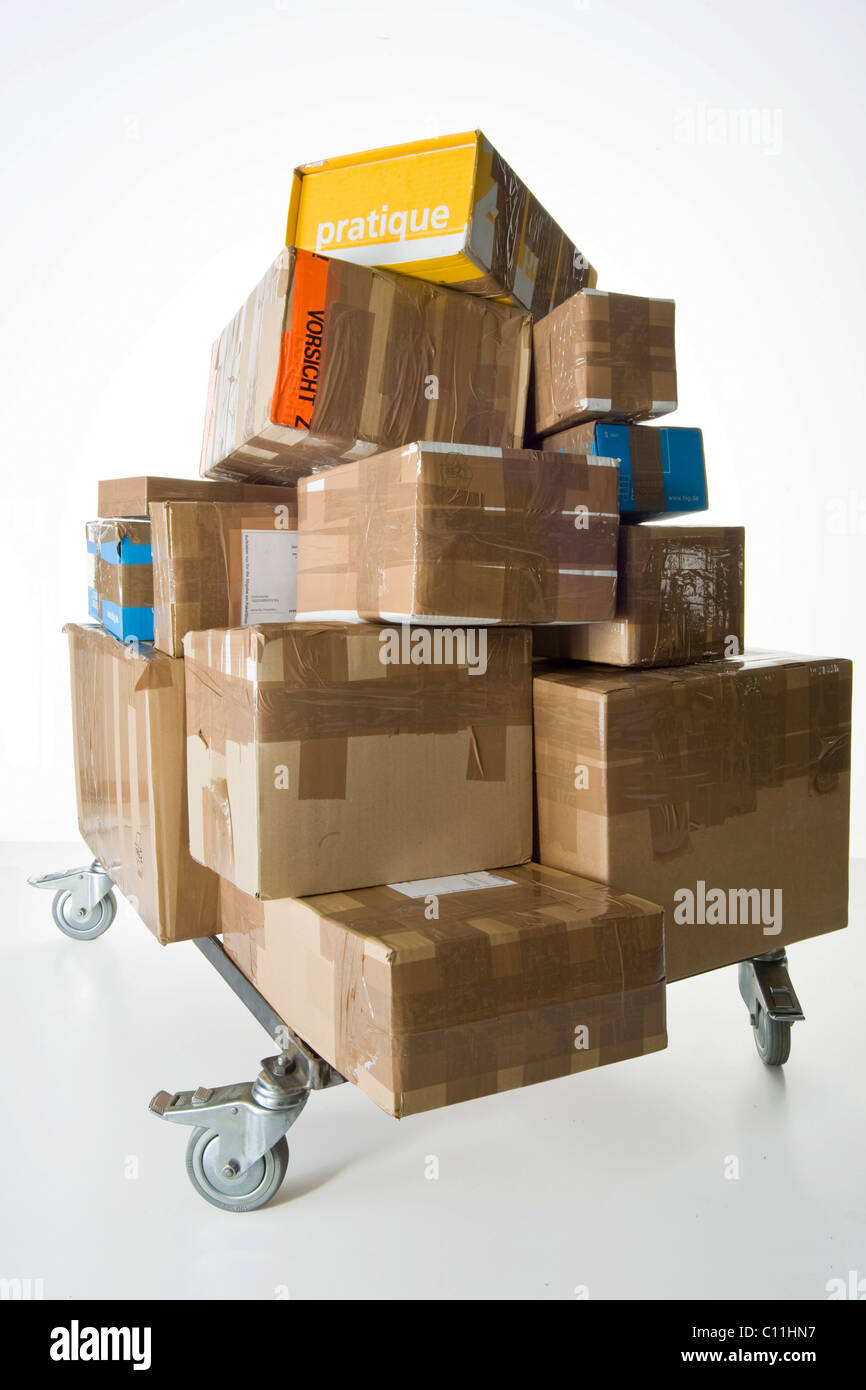 Packages on a push cart Stock Photo - Alamy