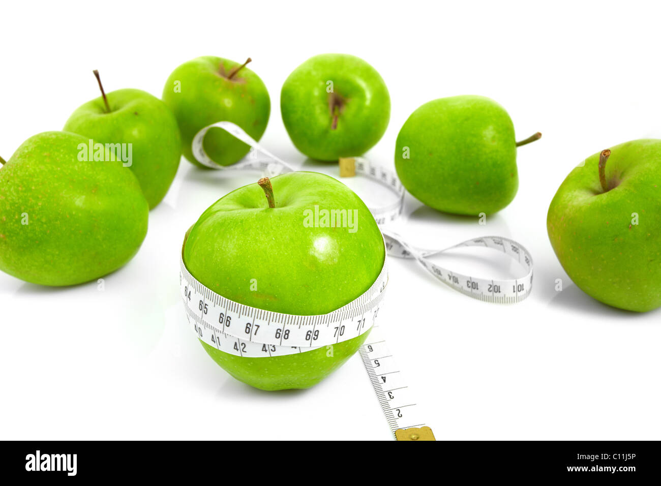 Green apples measured the meter, sports apples Stock Photo - Alamy