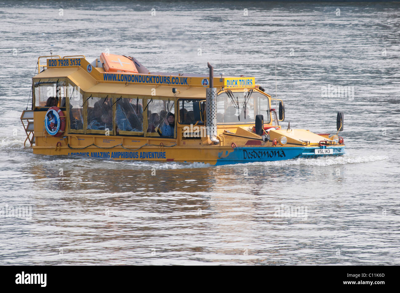 London Duck Tours yellow amphibious vehicle on the River Thames, London ...
