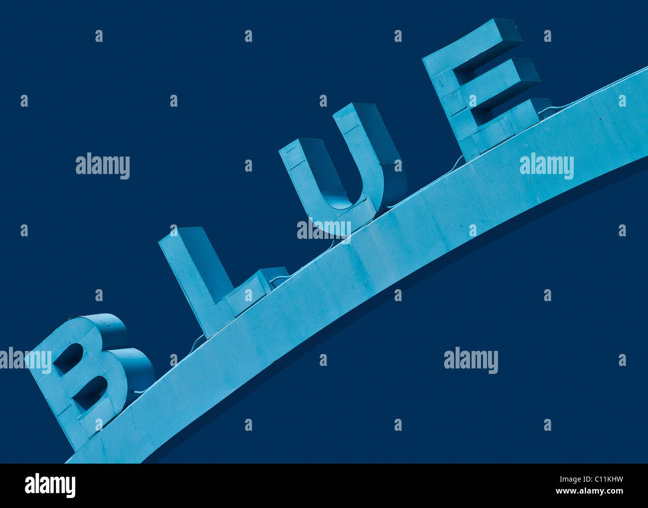 Blue sign blue sky Stock Photo - Alamy