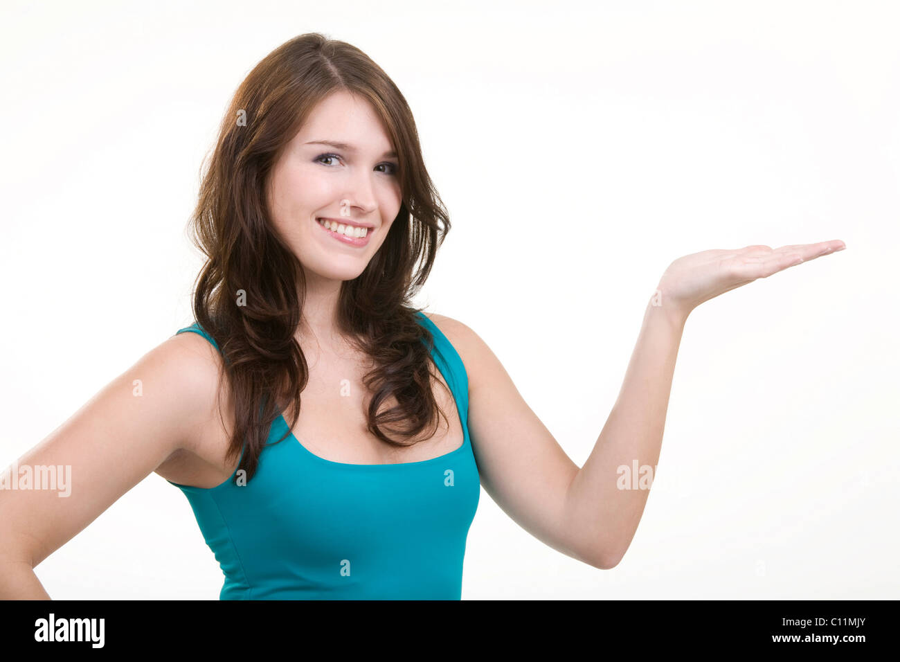A young woman presenting Stock Photo - Alamy