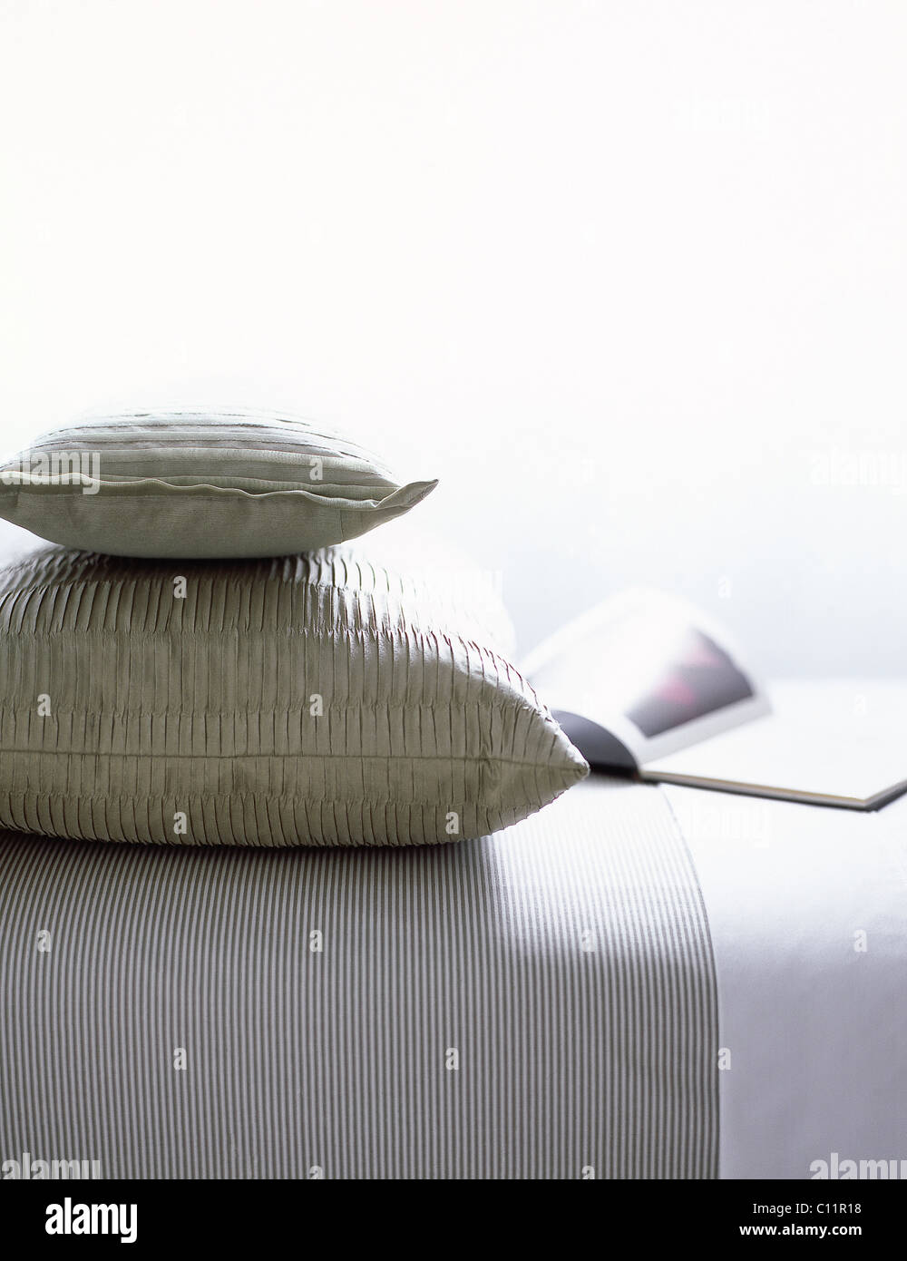 Bed with Pillows and Magazine Stock Photo - Alamy