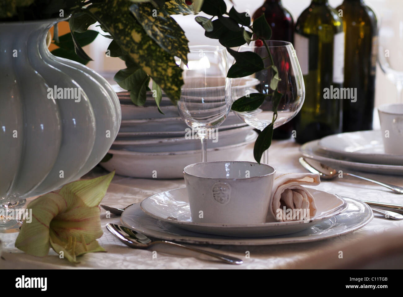 Elegantly set table with antique, fine china in a luxurious ambience ...