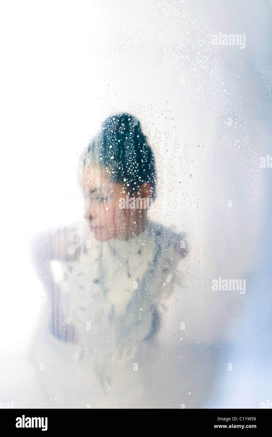 Woman behind frosted glass, mystic Stock Photo - Alamy