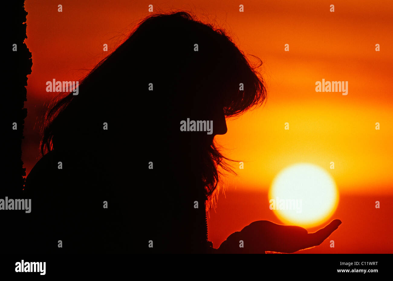 Silhouette of a woman, sunset Stock Photo - Alamy
