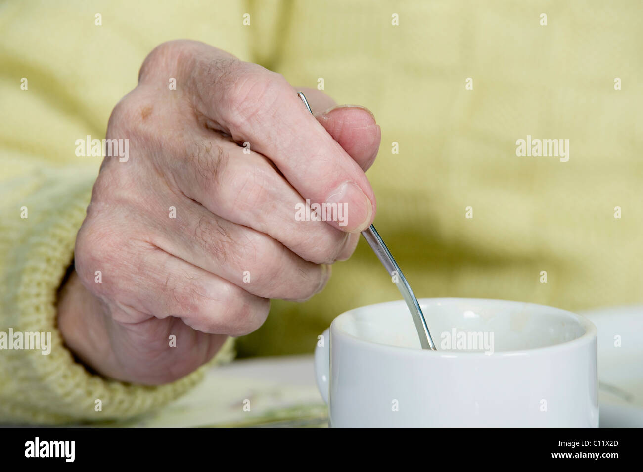 Mans hand stirring hi-res stock photography and images - Alamy