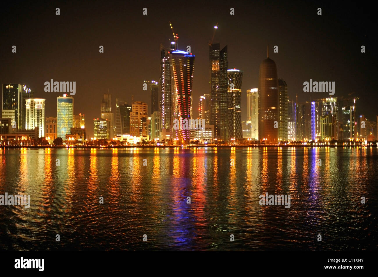 Night shot of the Doha skyline, Tornado Tower, Navigation Tower, Peace ...