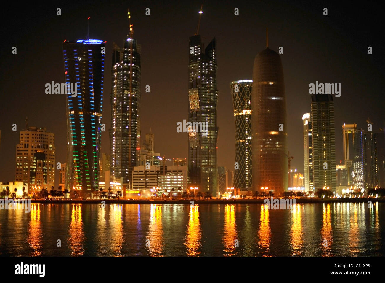 Night shot of the Doha skyline, Tornado Tower, Navigation Tower, Peace ...