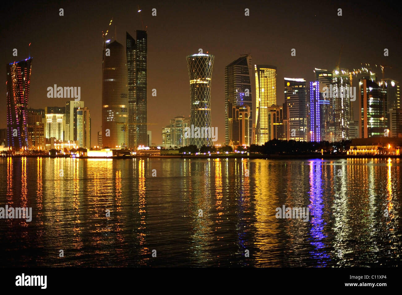 Night shot of the Doha skyline, Tornado Tower, Navigation Tower, Peace ...