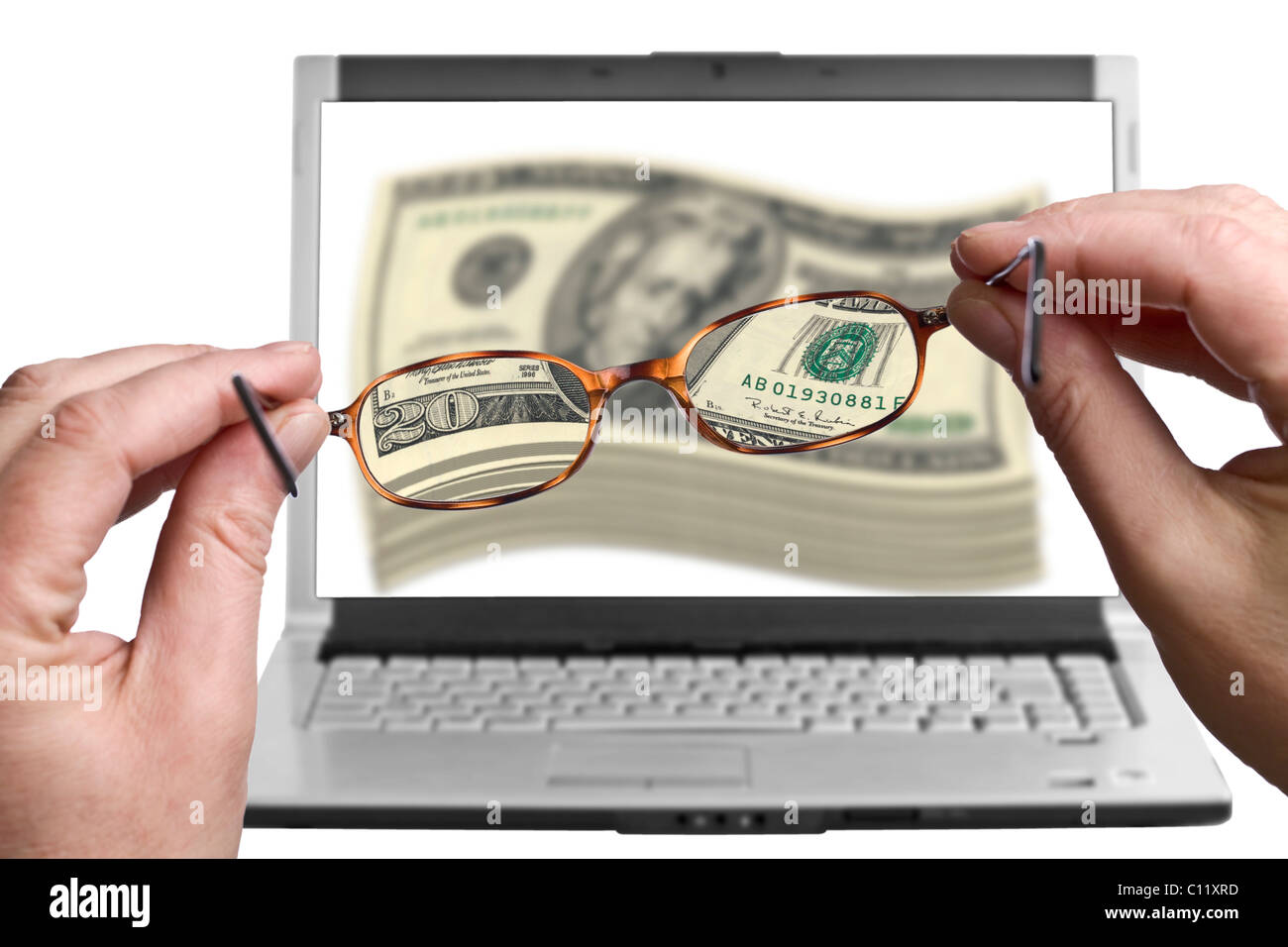 Reading glasses in front of a laptop screen Stock Photo - Alamy