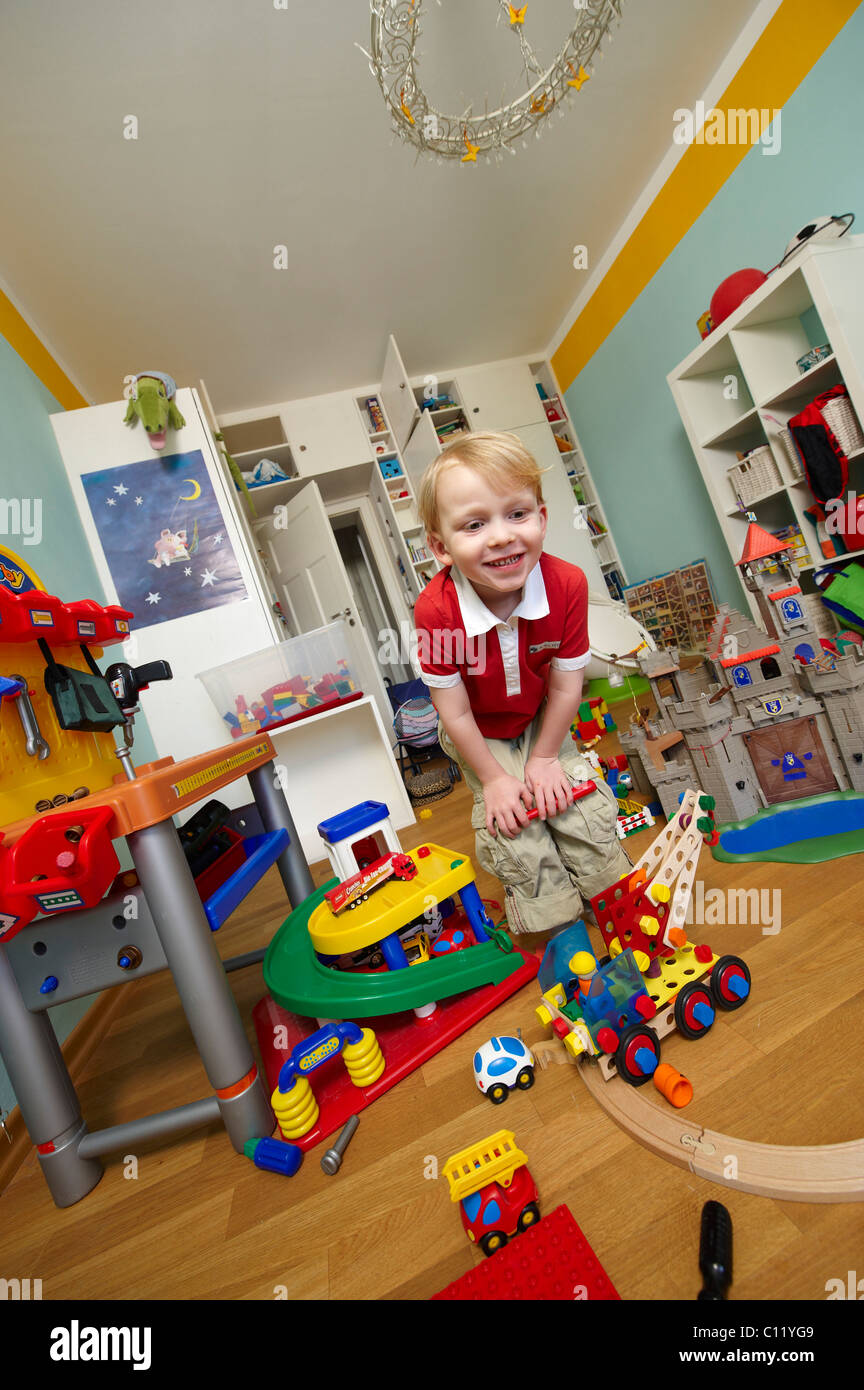 Child in a chaotic nursery Stock Photo - Alamy