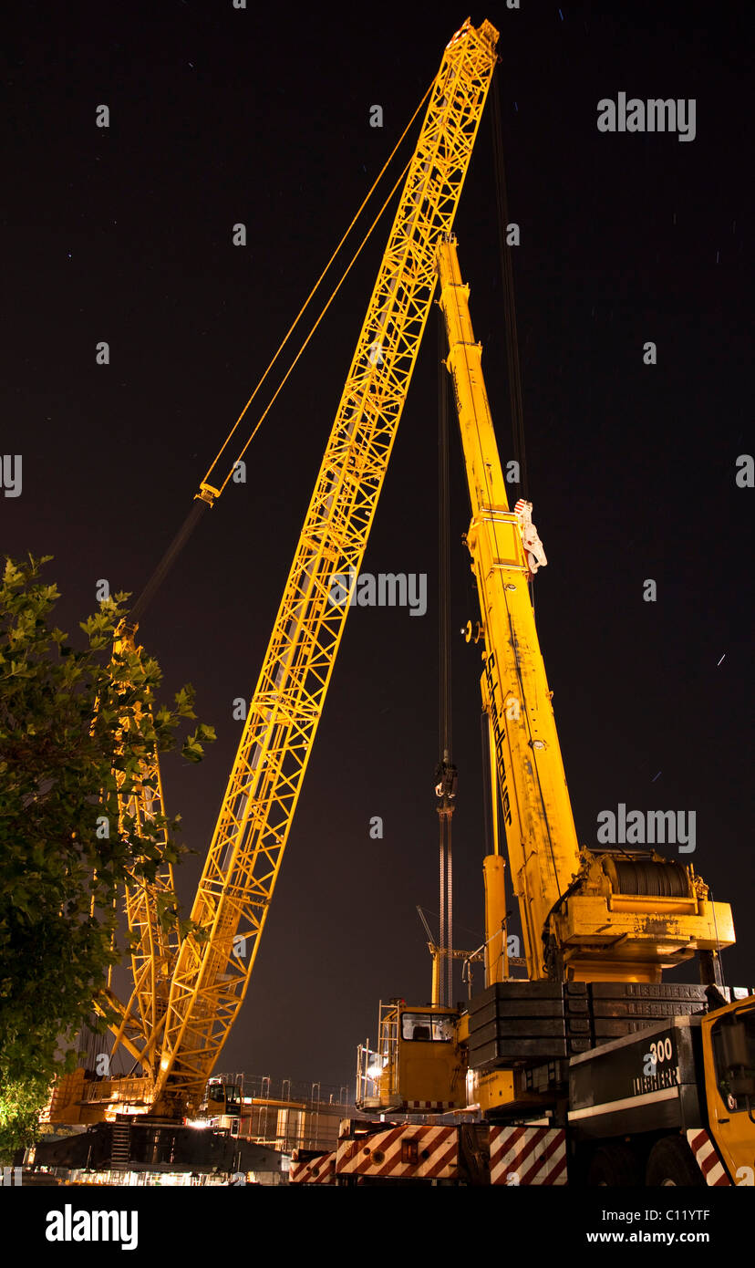 Demag CC 6800 SL giant crane, bridge construction, night scene ...