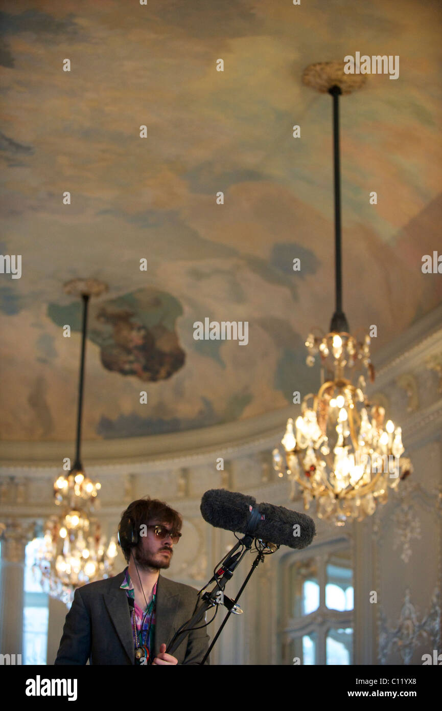A sound technician records a performance of pianist Rosy Chan during ...