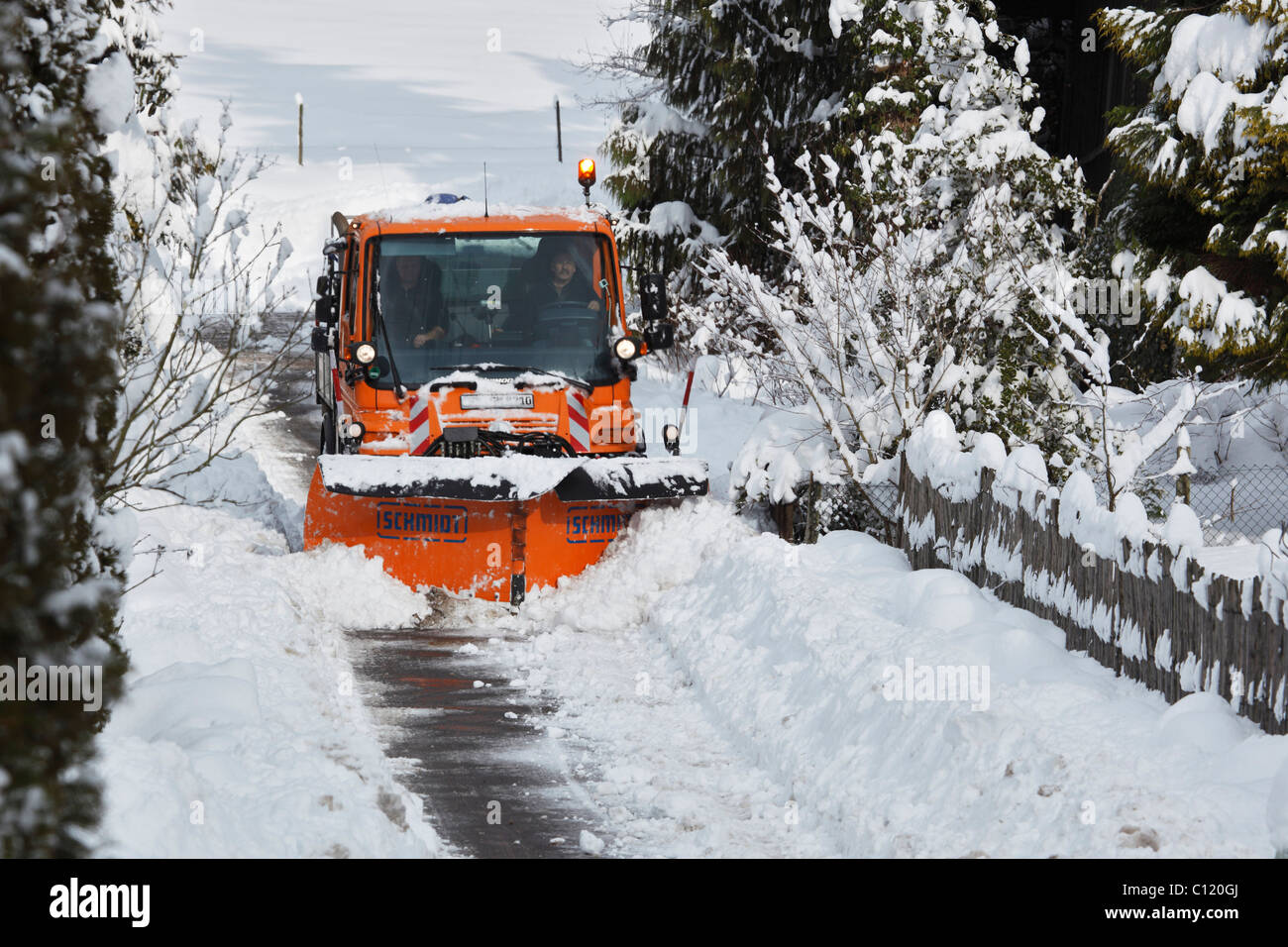 Winter road clearance, Unimog bulldozer, clearing snow, snow plough ... Winter road clearance, Unimog bulldozer, clearing snow, snow plough ...