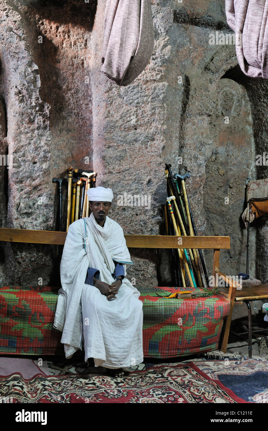Interior of an ethiopian orthodox church with sitting priest in ...