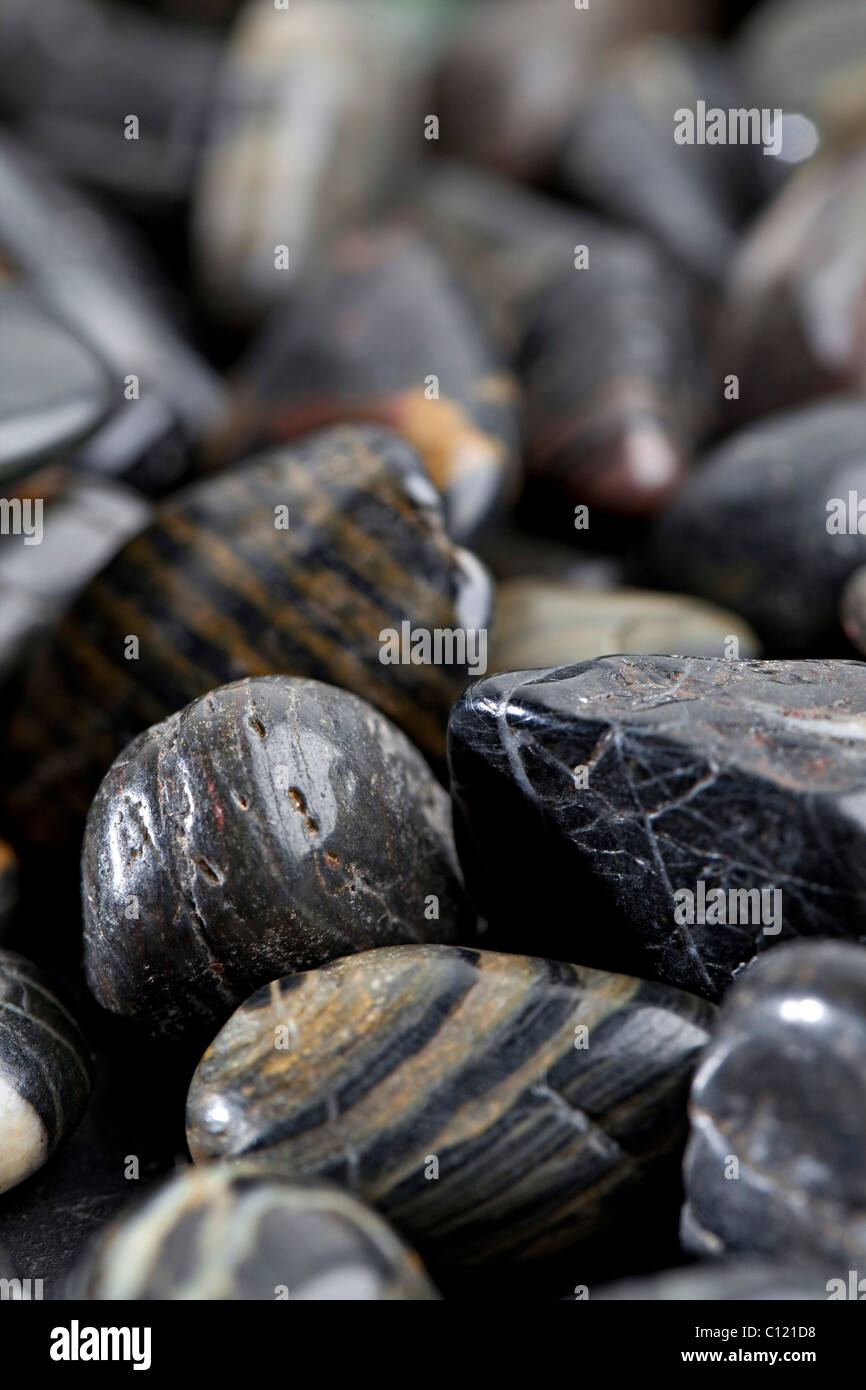 Striped pebbles in different colours Stock Photo - Alamy