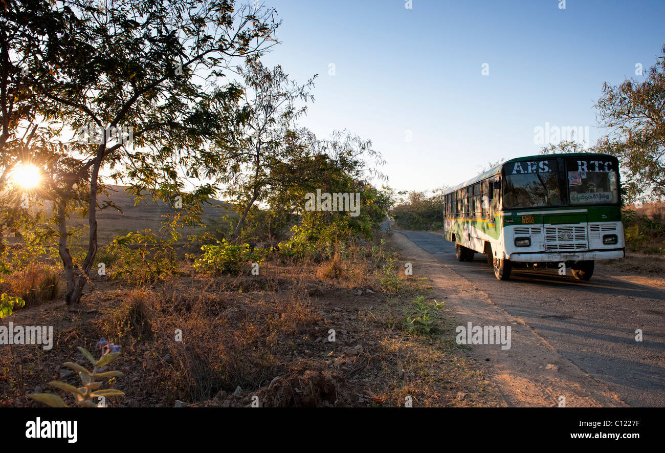 Indian bus / coach traveling early morning at sunrise in the ...