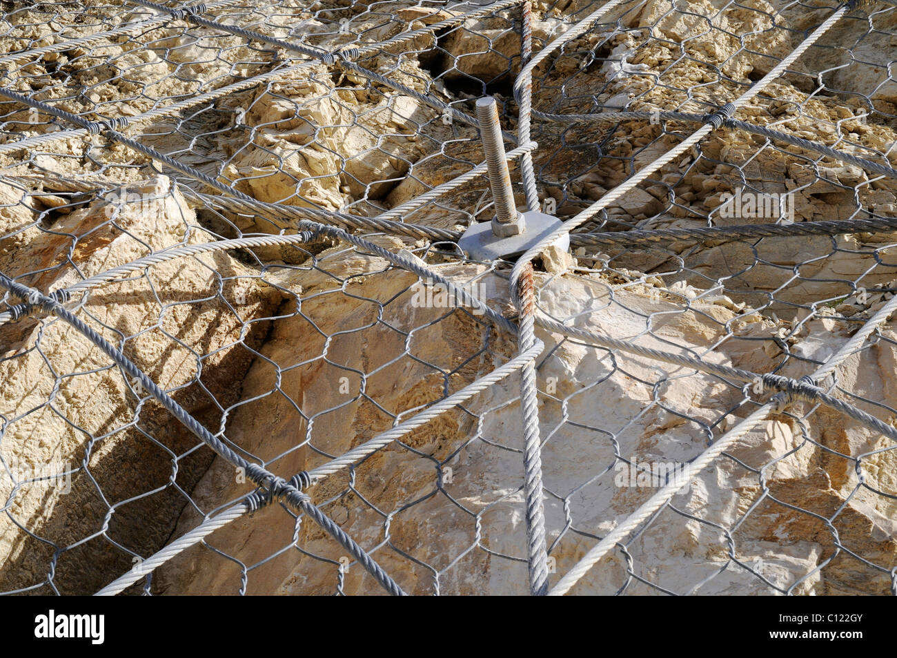Wire mesh securing a slope from rockfall or landslide, Costa Blanca ...