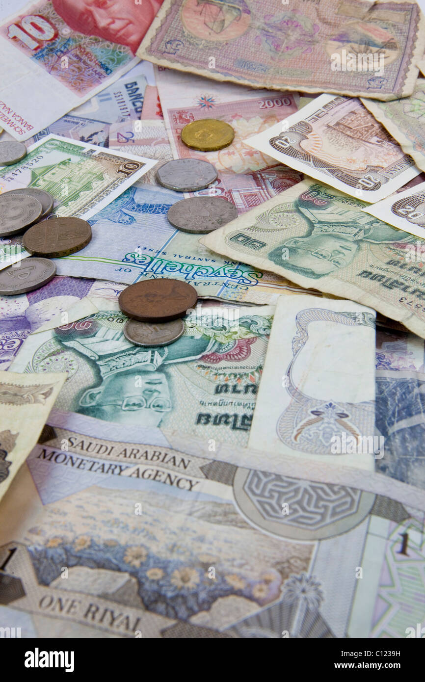 Banknotes and coins from different currencies Stock Photo - Alamy