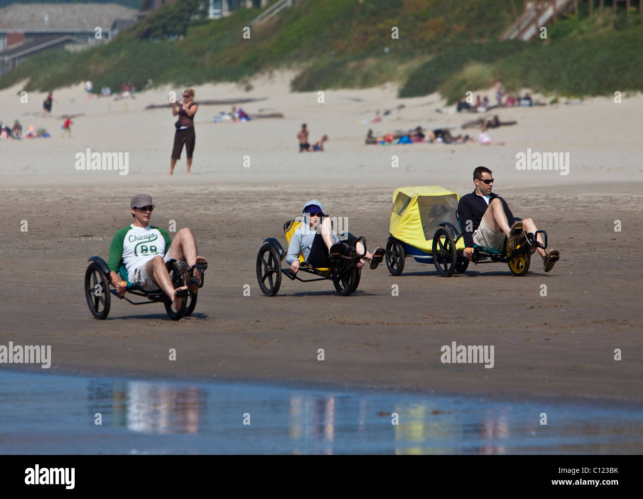 Tourists with three-wheelers at Cannon Beach, Clatsop County, Oregon ...