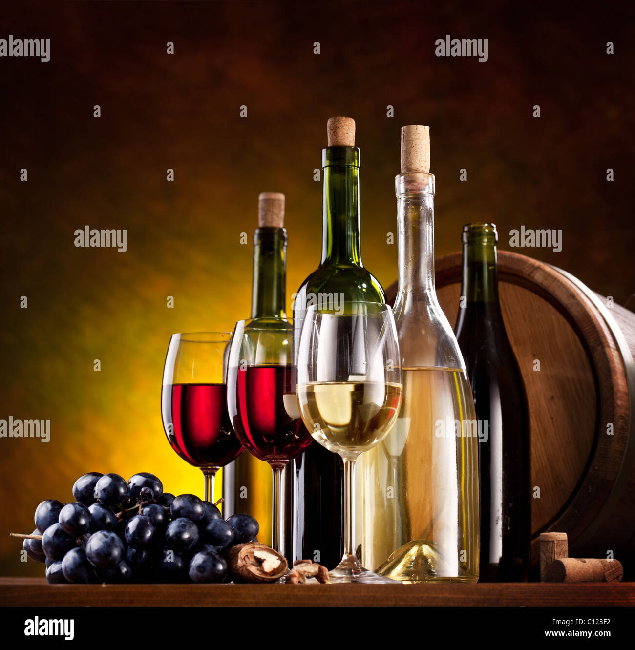 Still life with wine bottles, glasses and oak barrels Stock Photo - Alamy
