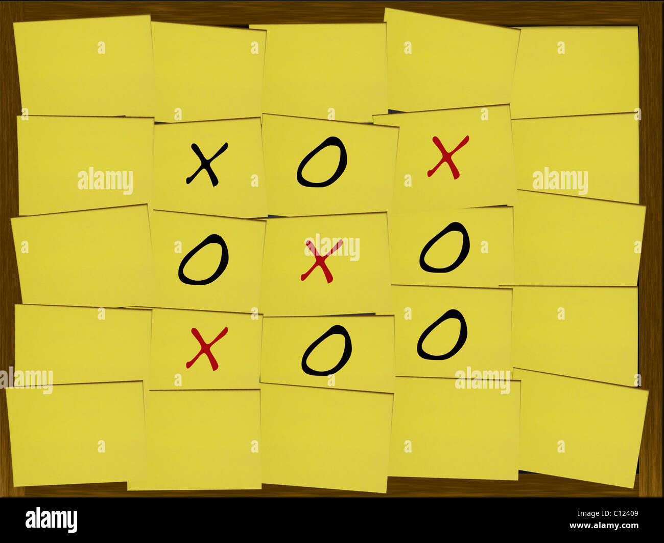 Tic Tac Toe game on yellow post-it notes Stock Photo - Alamy