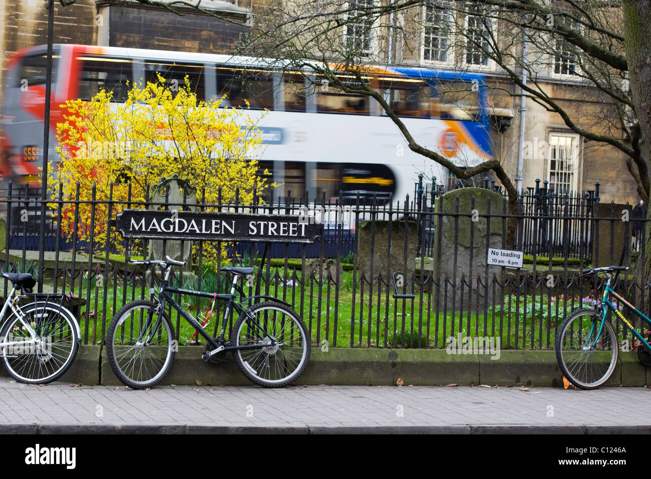 A Push Bike lent on the Railings at Magdalen Street in Oxford Stock ...