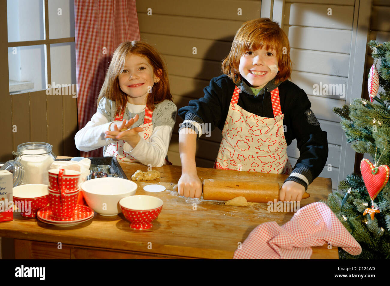 Christmas bakery, children baking Stock Photo - Alamy