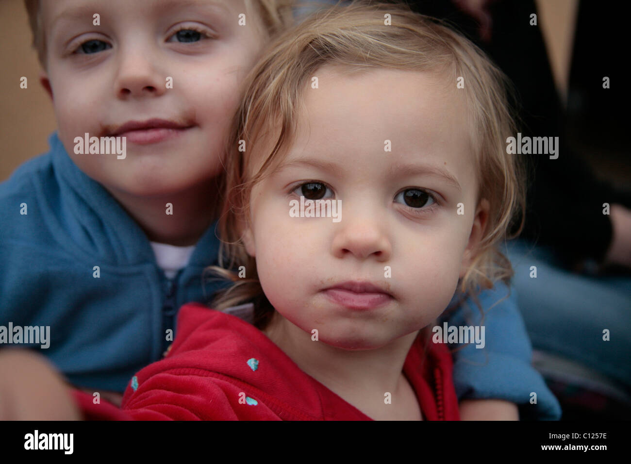 Boy and girl making faces Stock Photo - Alamy