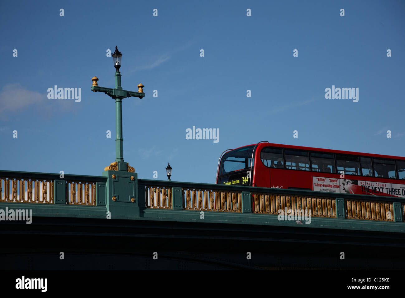 London bus crossing the thames on a bridge Stock Photo - Alamy