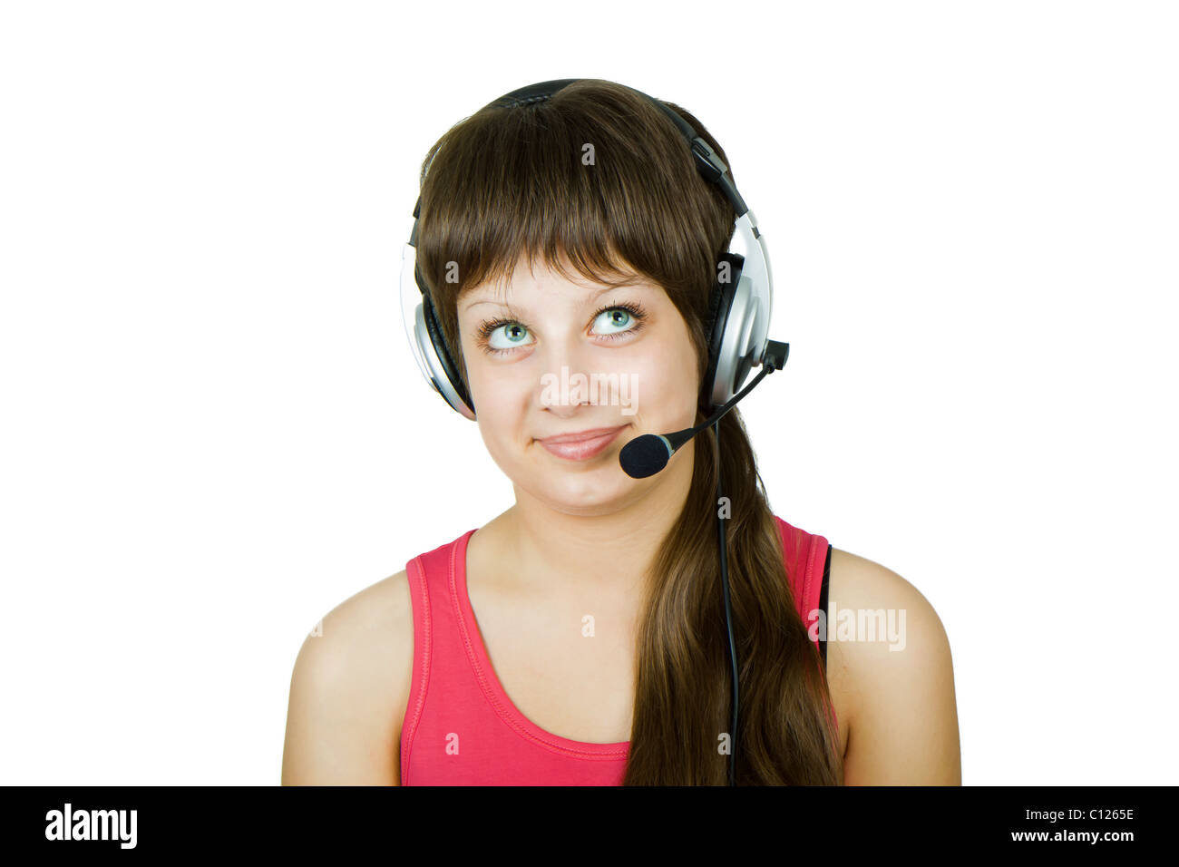 smiling girl in headphones with a microphone on the isolated white ...