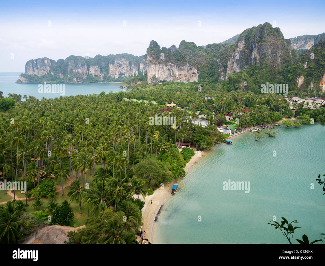 View of palm groves and chalk rock formations with the Hat Rai Leh West ...