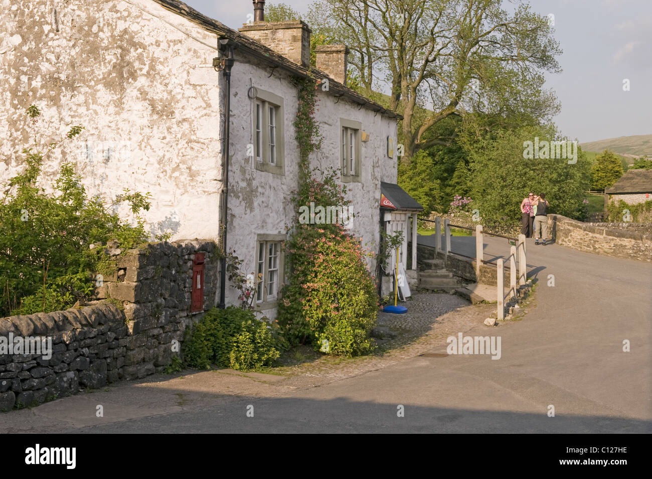 Malham village shop and Malham bridge spanning Malham Beck Stock Photo ...