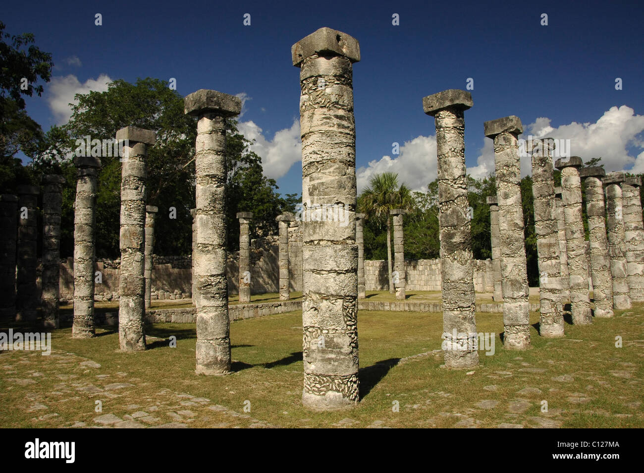 Stone pillars in morning sunshine at Chichen Itza Stock Photo - Alamy