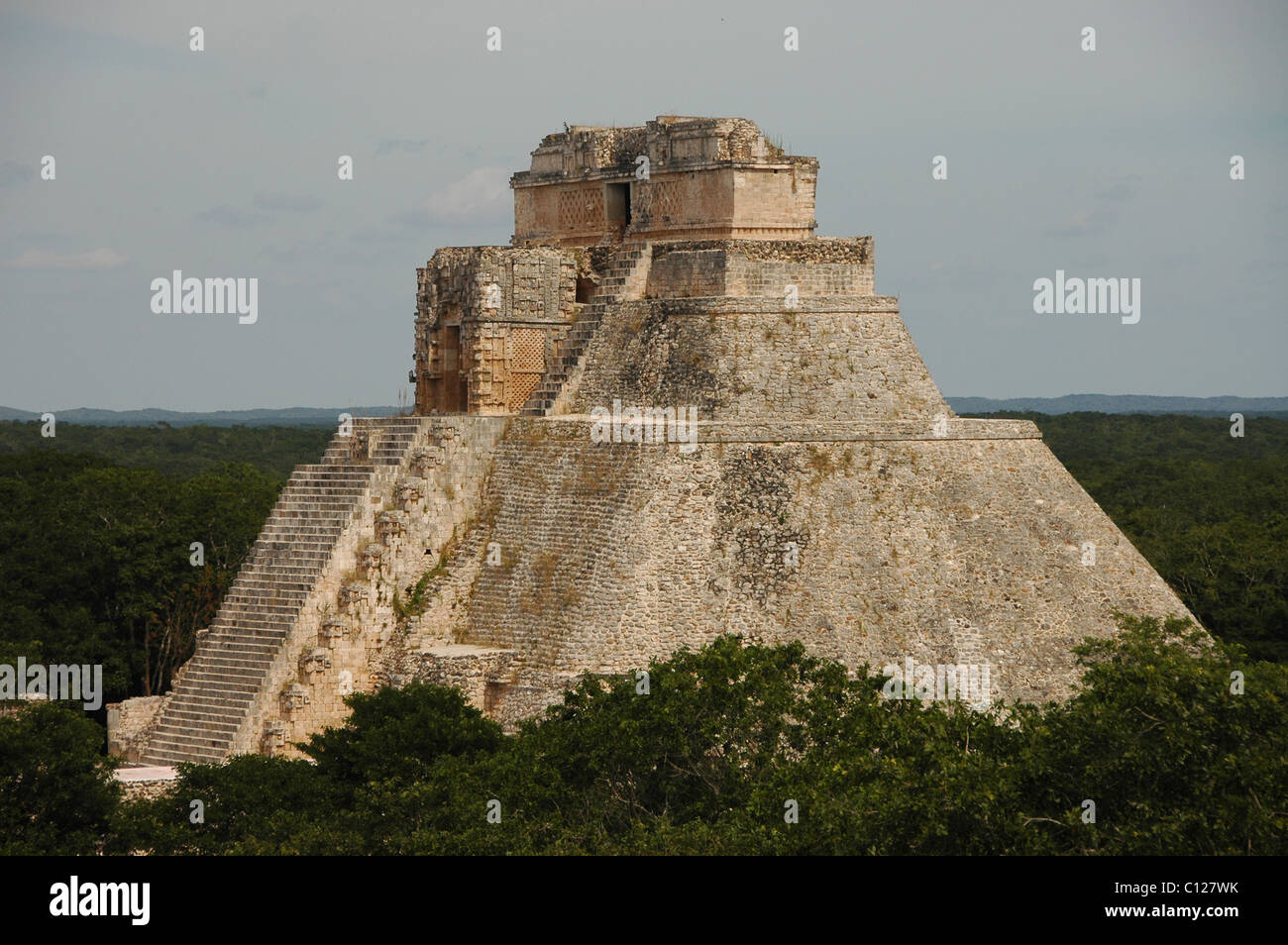 Mayan pyramid towering over jungle Stock Photo - Alamy