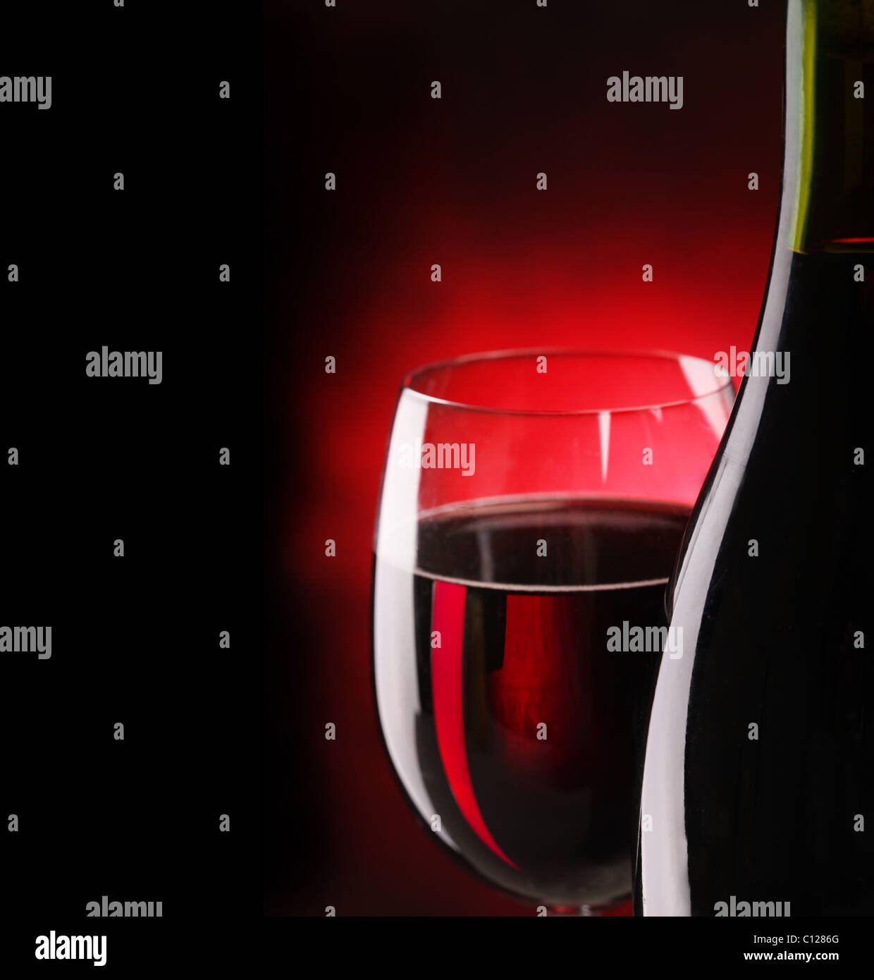 Still life with glass and bottle of wine Stock Photo - Alamy