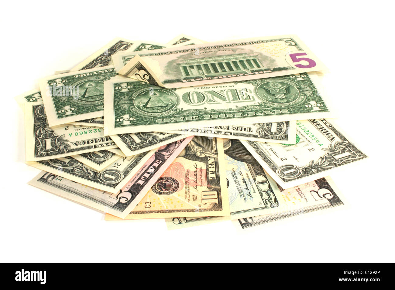 a pile of dollar bills before a white background Stock Photo - Alamy