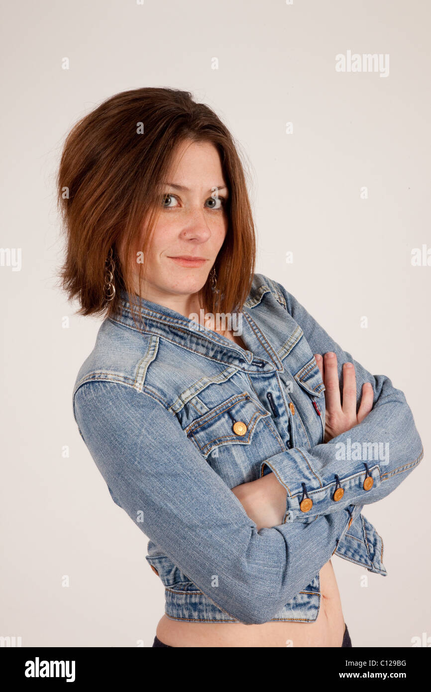 Lovely Woman In Blue Jean Jacket A Serious Expressing And With Her Arms