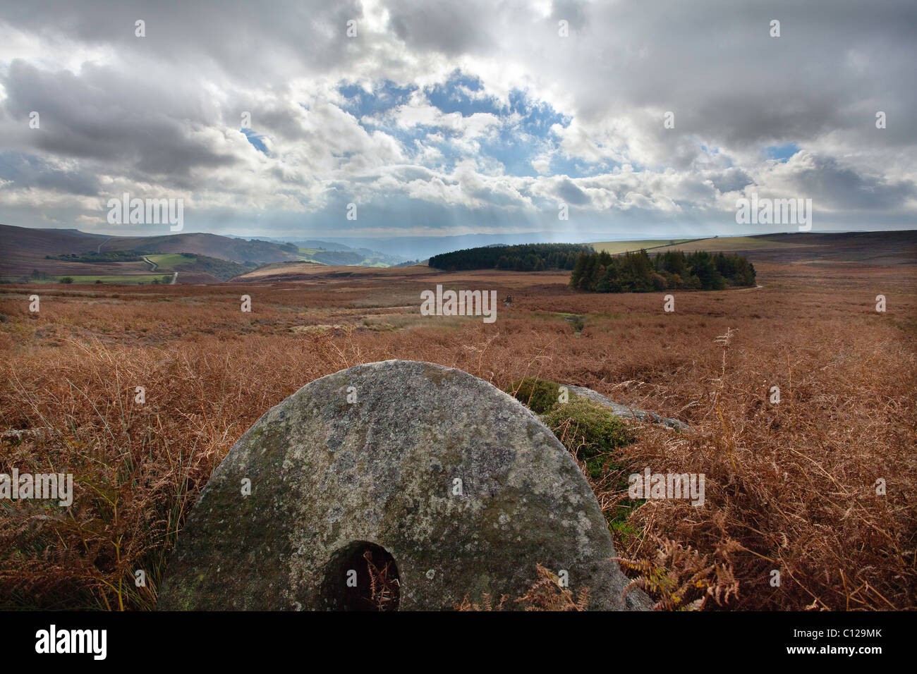 Millstone and view of Hathersage in the Peak District Stock Photo - Alamy