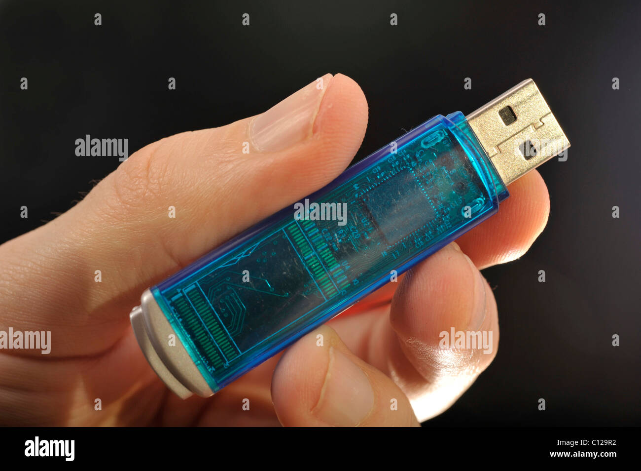 Hand holding a USB memory stick Stock Photo - Alamy