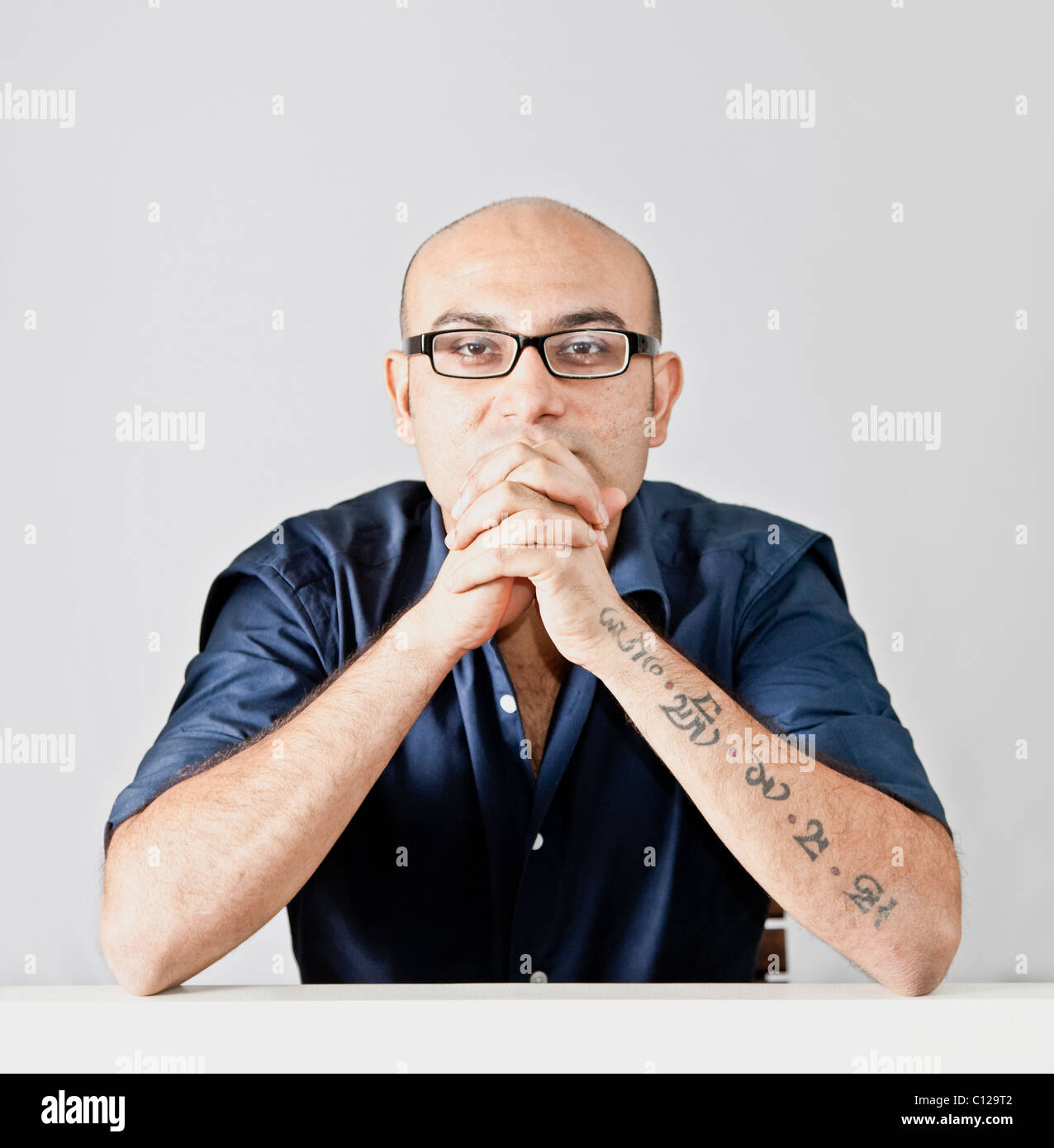 Man thinking alone at window with his thoughts Stock Photo - Alamy