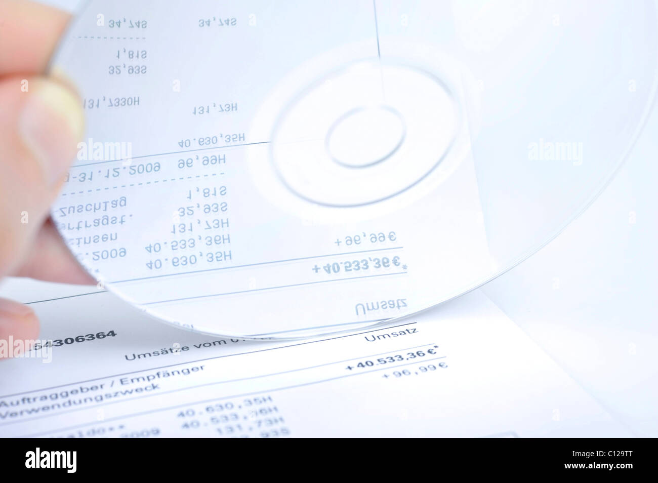 Data cd and bank statement Stock Photo - Alamy