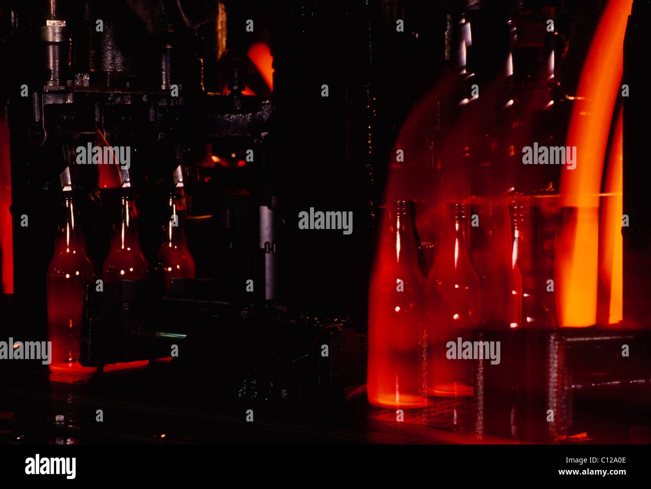 Close up view of assembly line for glass bottles Stock Photo - Alamy