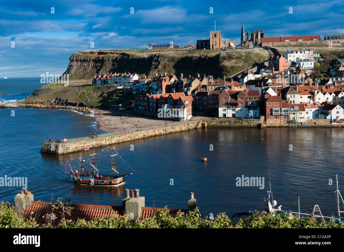 Boat Sailing Into Whitby Harbour, North Yorkshire, UK Stock Photo - Alamy