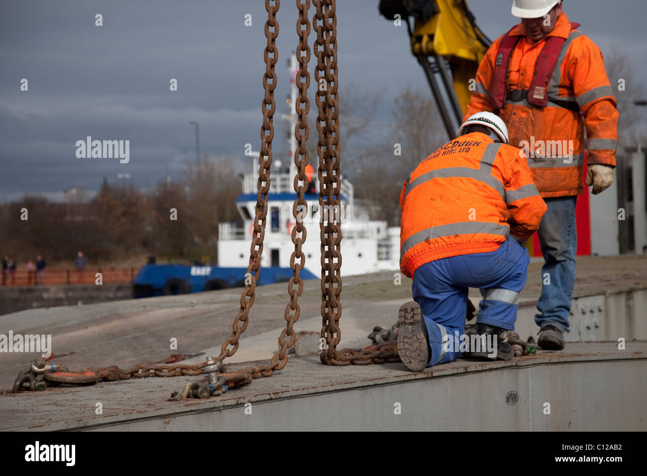 Crane security lifting chains in use during the unloading, & Delivery ...