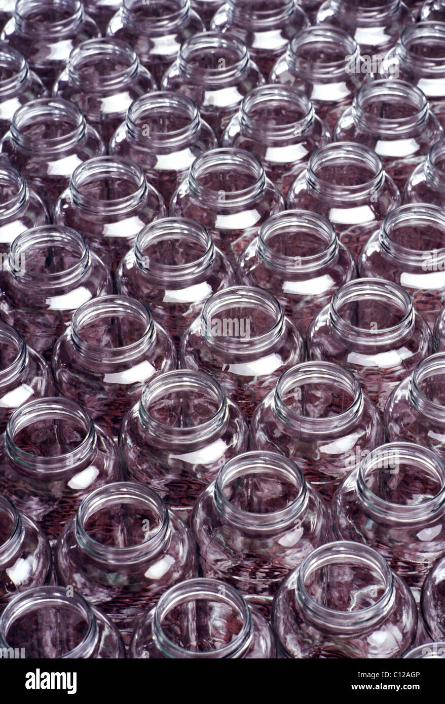 Glass bottles on the assembly line of a glass product manufacturing ...