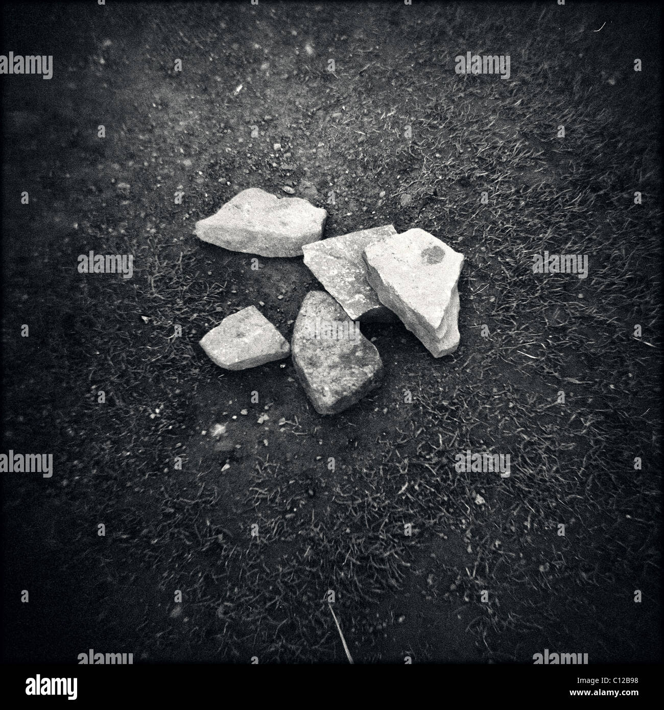 5 small rocks on the ground Stock Photo - Alamy