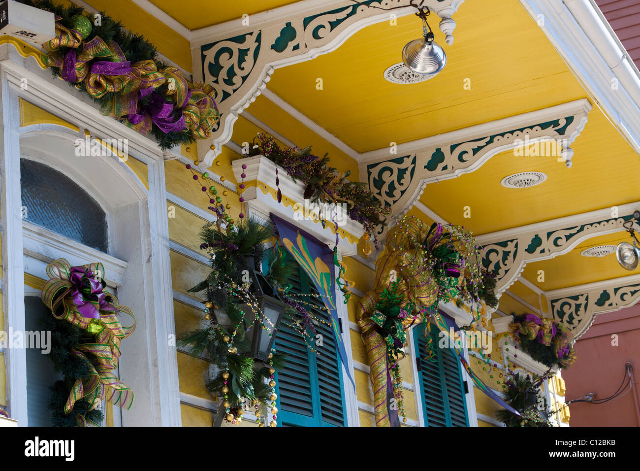 Closeup of decorative corbels with windows decorated for Mardi Gras on ...