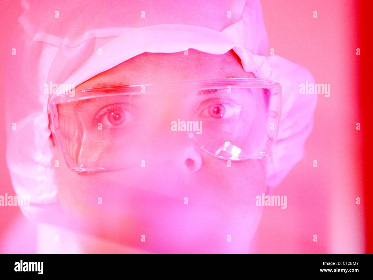 Female technician working in a clean room environment used to fabricate ...