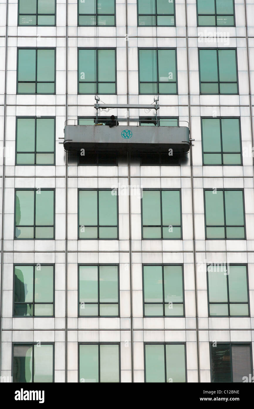A window cleaning cradle on Canary Wharf London UK Stock Photo - Alamy